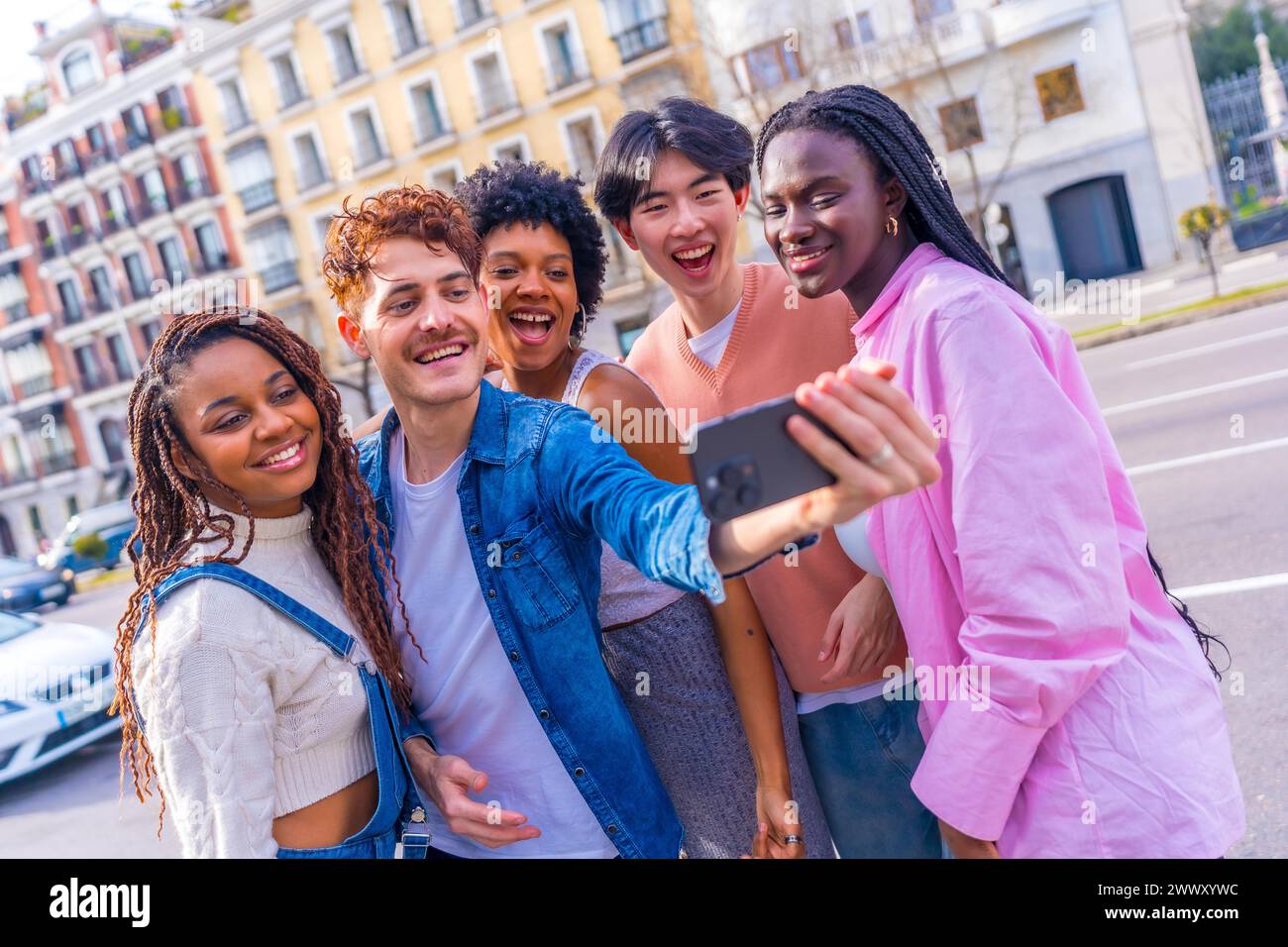 Multiracial young millennial friends taking a selfie standing together ...