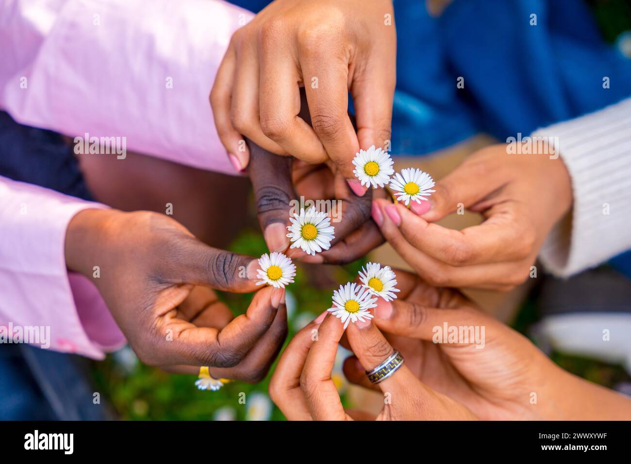 Top view of three unrecognizable african young female friends holding ...