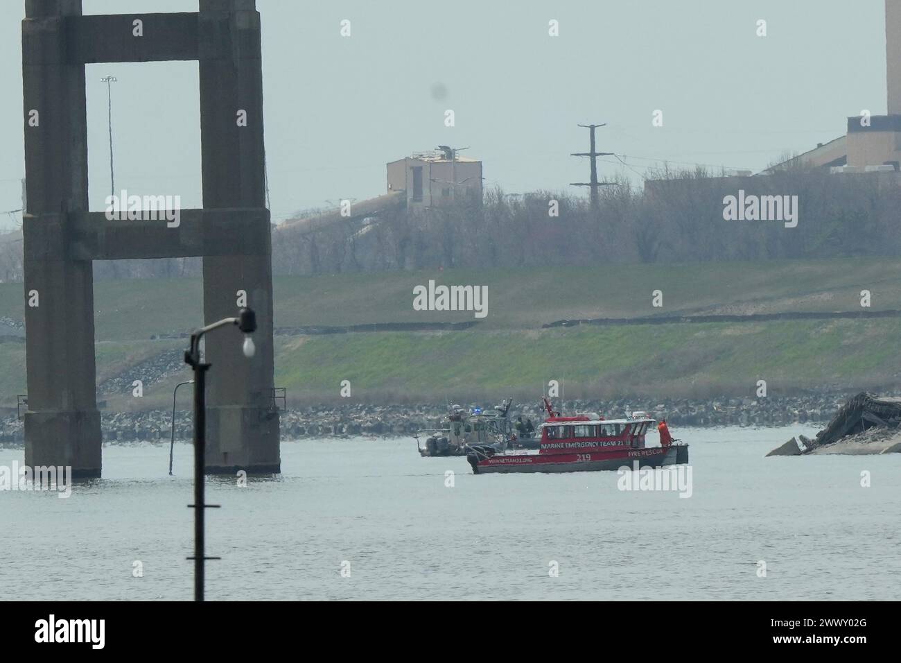Boats move wreckage of the Francis Scott Key Bridge after it was struck ...