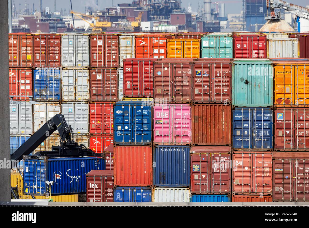 Container terminal in the port of Mannheim, sea containers are stacked ...