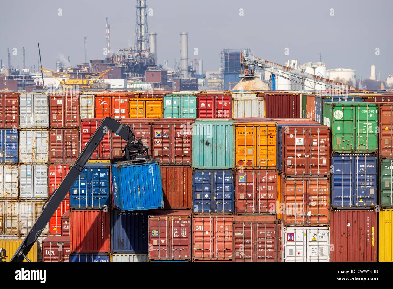Container terminal in the port of Mannheim, sea containers are stacked ...