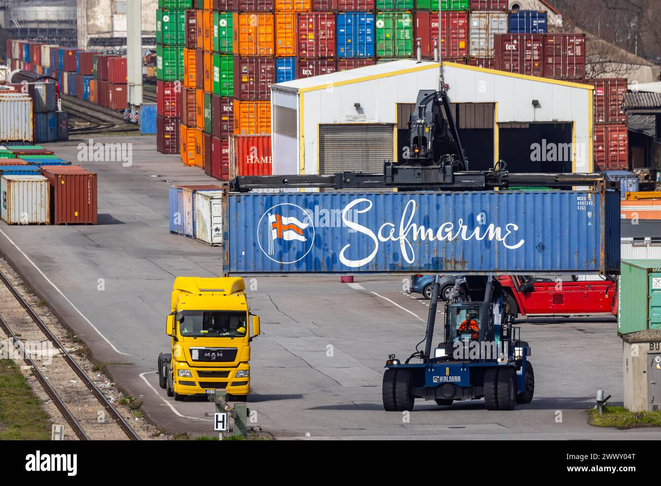 Container terminal in the port of Mannheim, sea containers are stacked ...