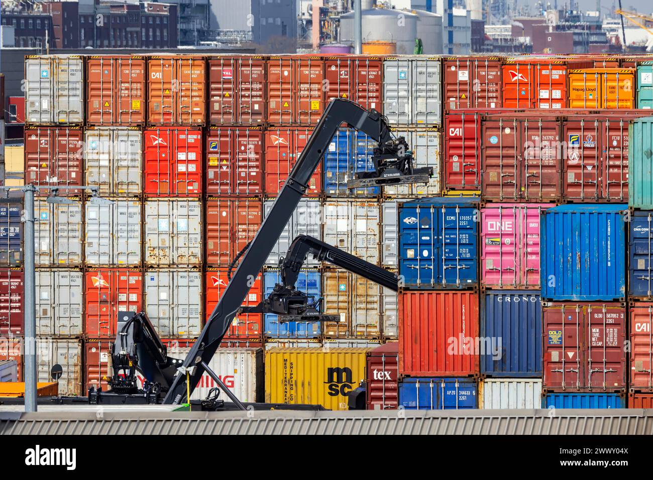 Container terminal in the port of Mannheim, sea containers are stacked ...