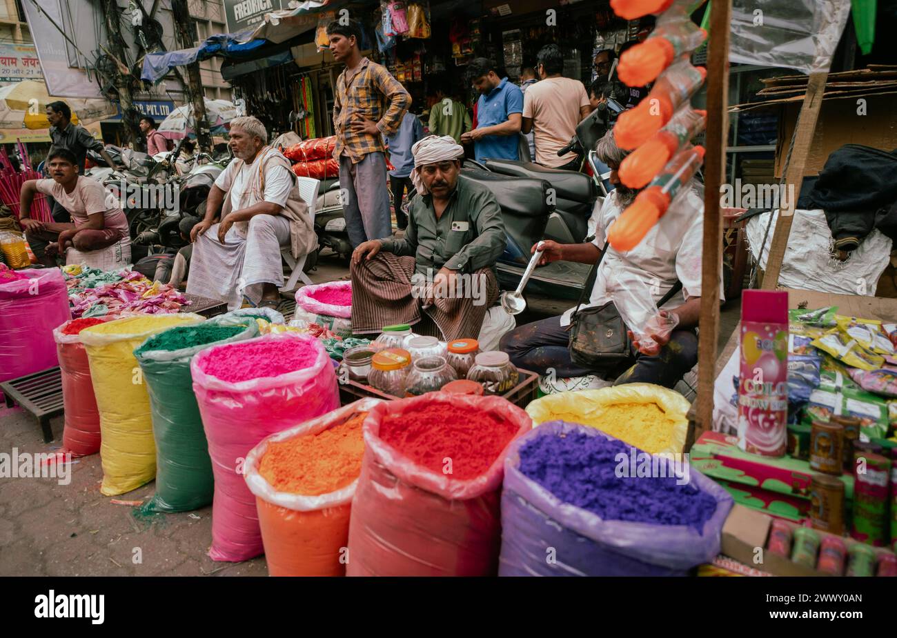 Vendor sells Holi celebration items in a street market, ahead of Holi ...