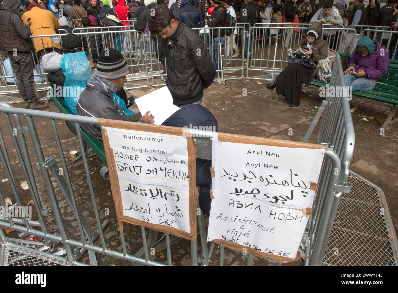 Refugees from Syria waiting to be registered at the Central Reception ...