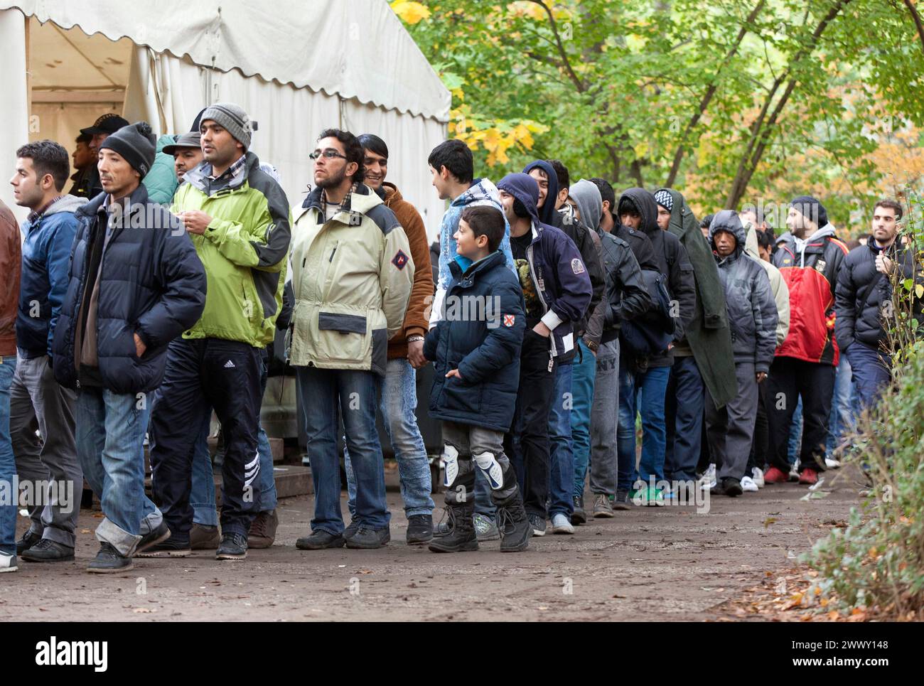 Refugees from Syria waiting to be registered at the Central Reception ...