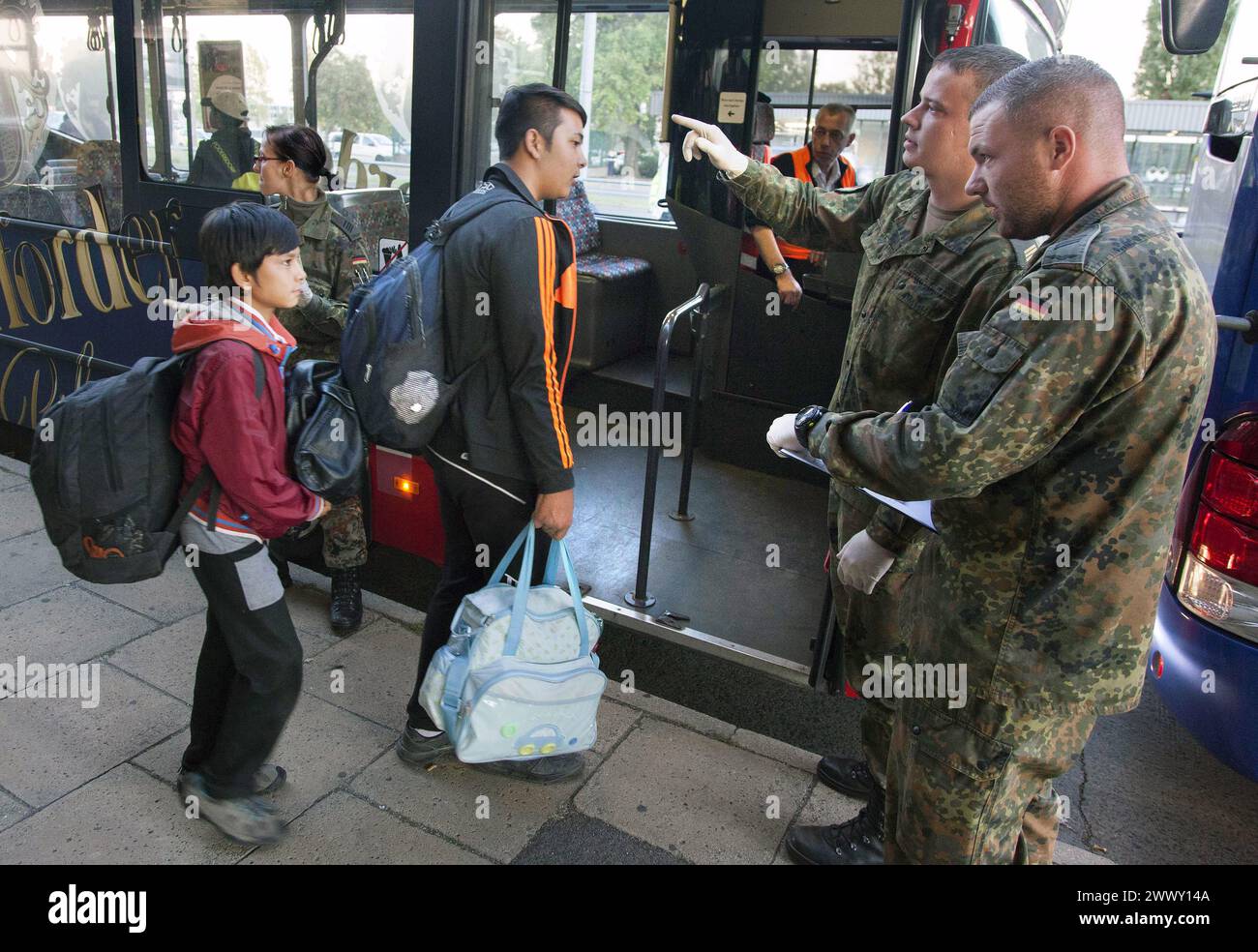Syrian refugees arrive at Schoenefeld station on a special train. They ...