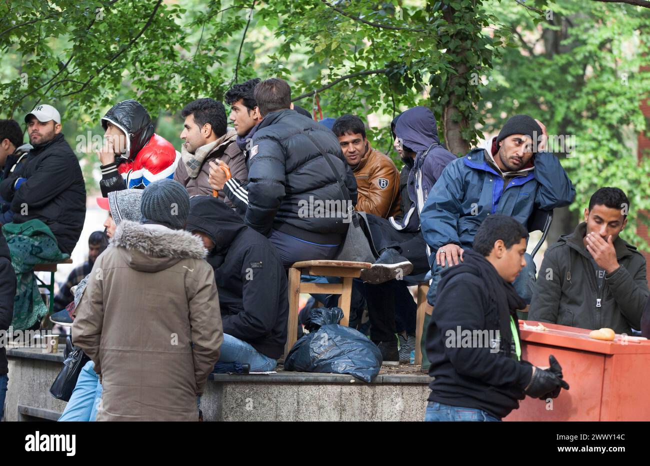 Refugees from Syria waiting to be registered at the Central Reception ...
