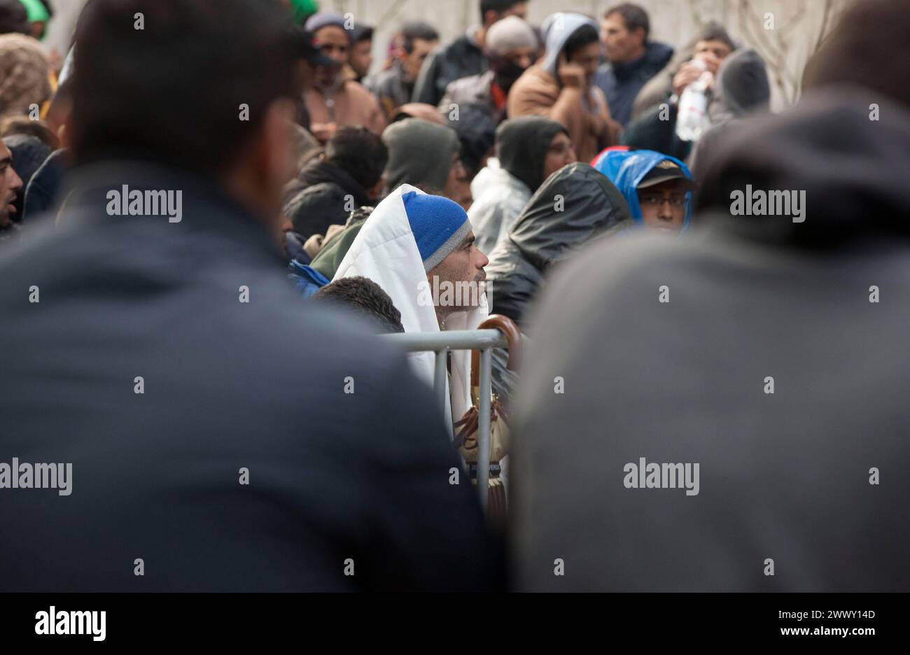 Refugees from Syria waiting to be registered at the Central Reception ...