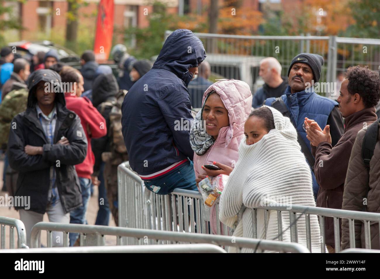 Refugees from Syria waiting to be registered at the Central Reception ...