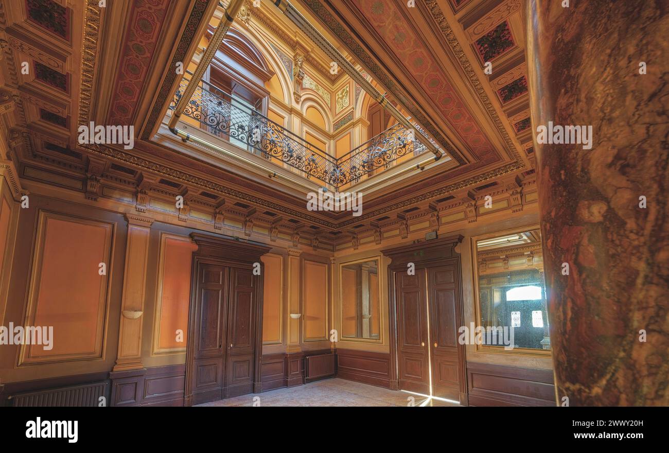 Magnificent staircase with ceiling fresco, framed by columns and ...