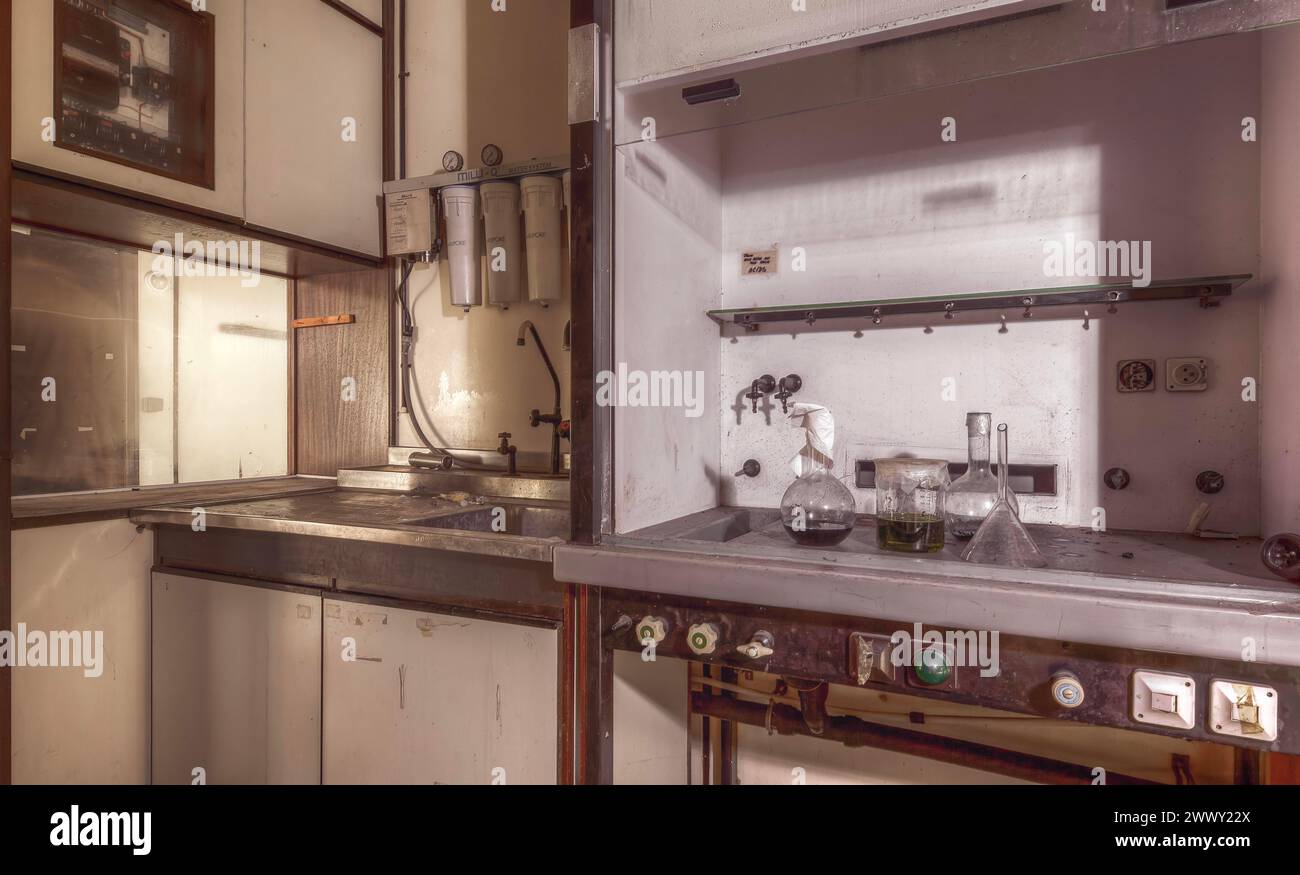 An abandoned laboratory with old equipment and test tubes on the ...