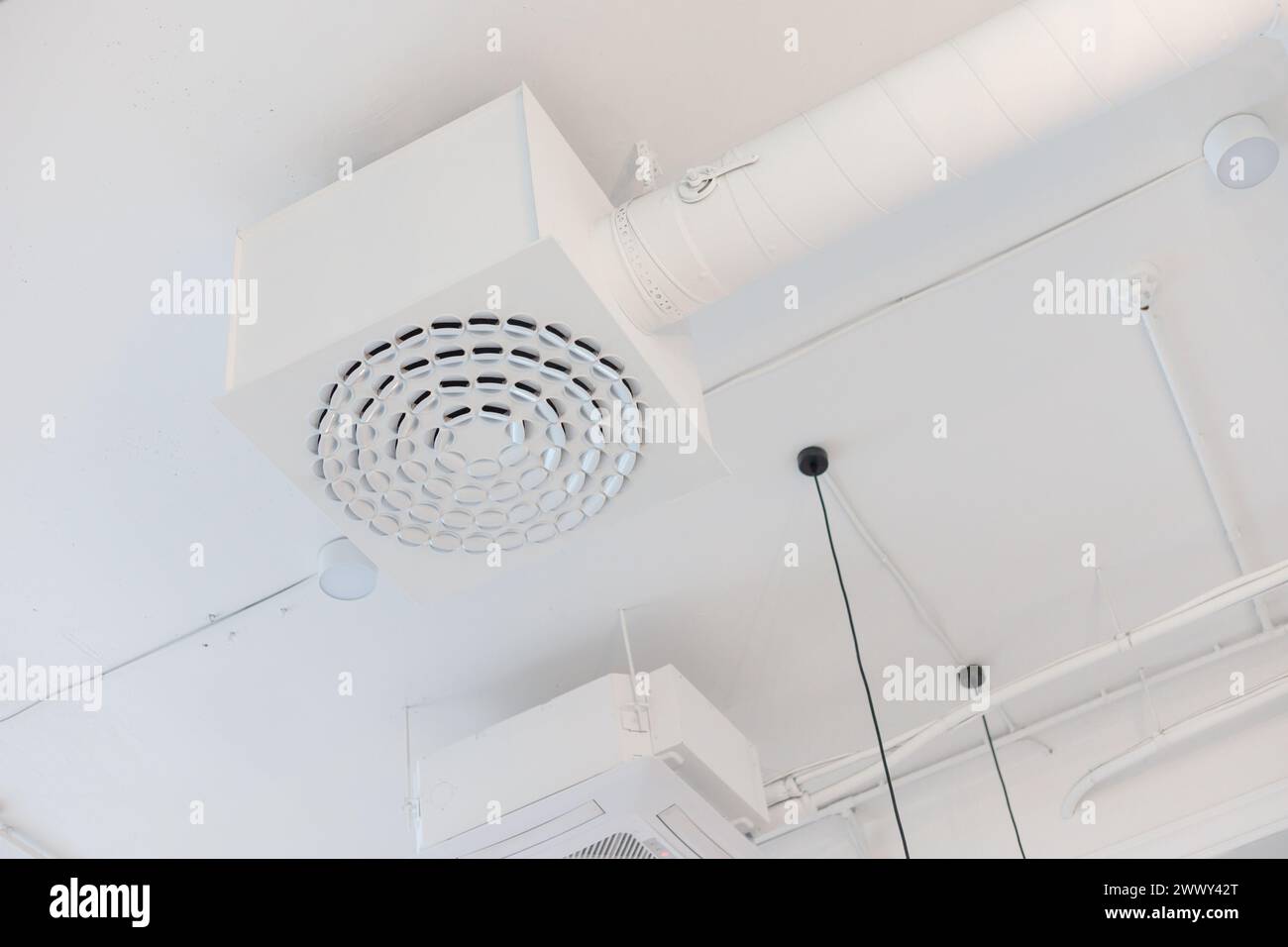 Ventilation duct system with supply grid painted in white under the ...