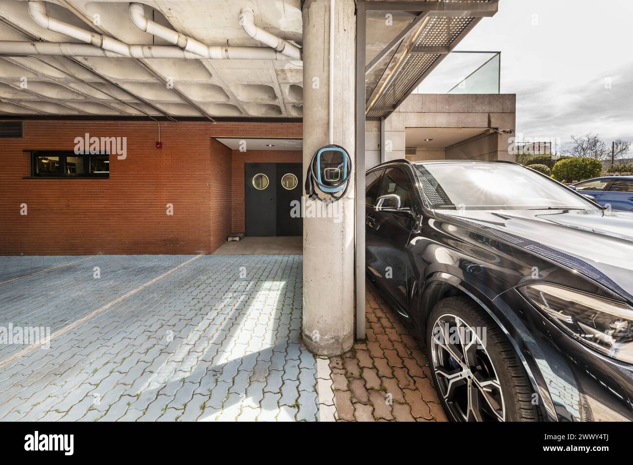 A parking area on the ground floor of an office building with power ...