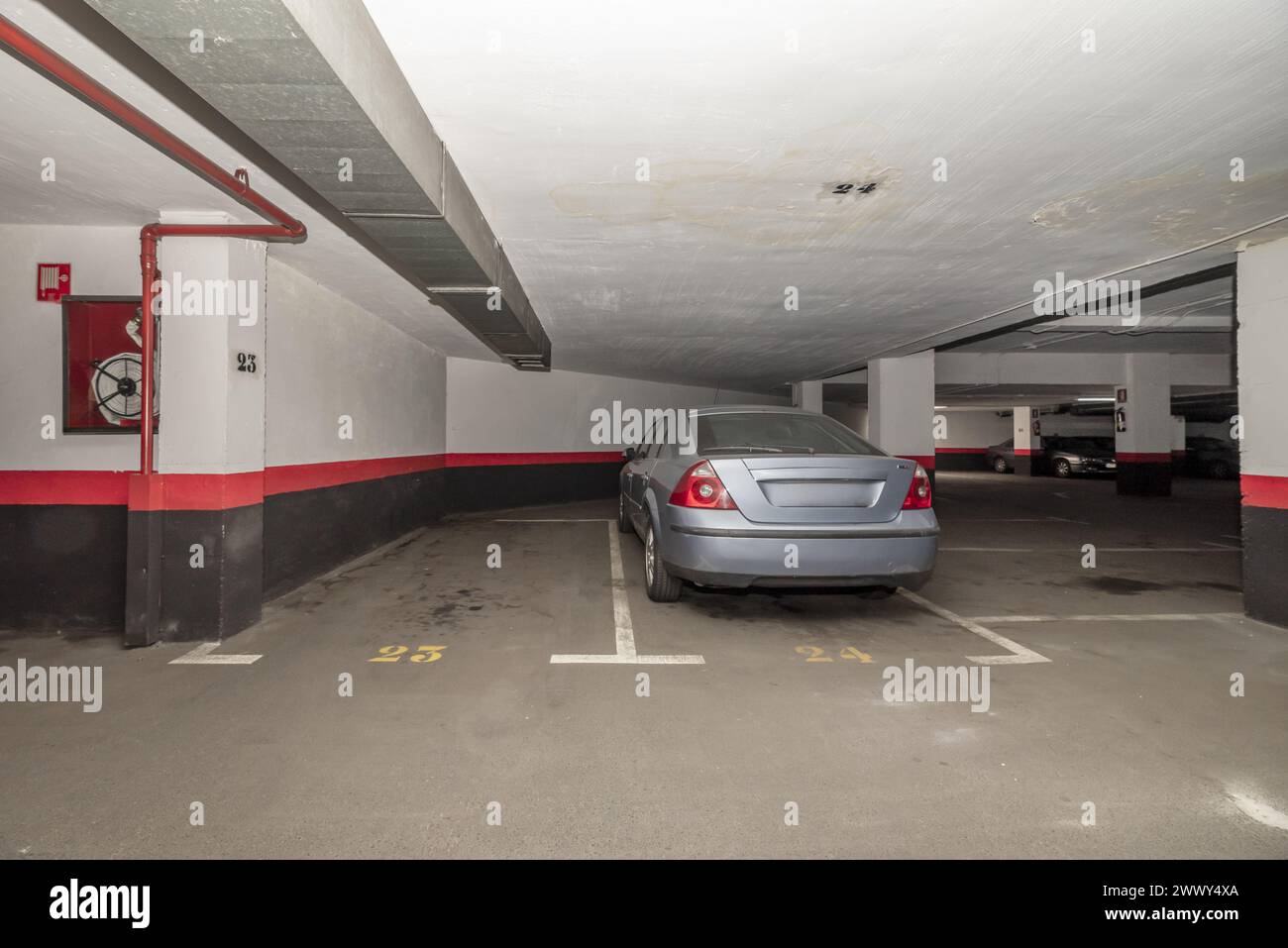 parking on the ground floor of a residential building with empty spaces ...