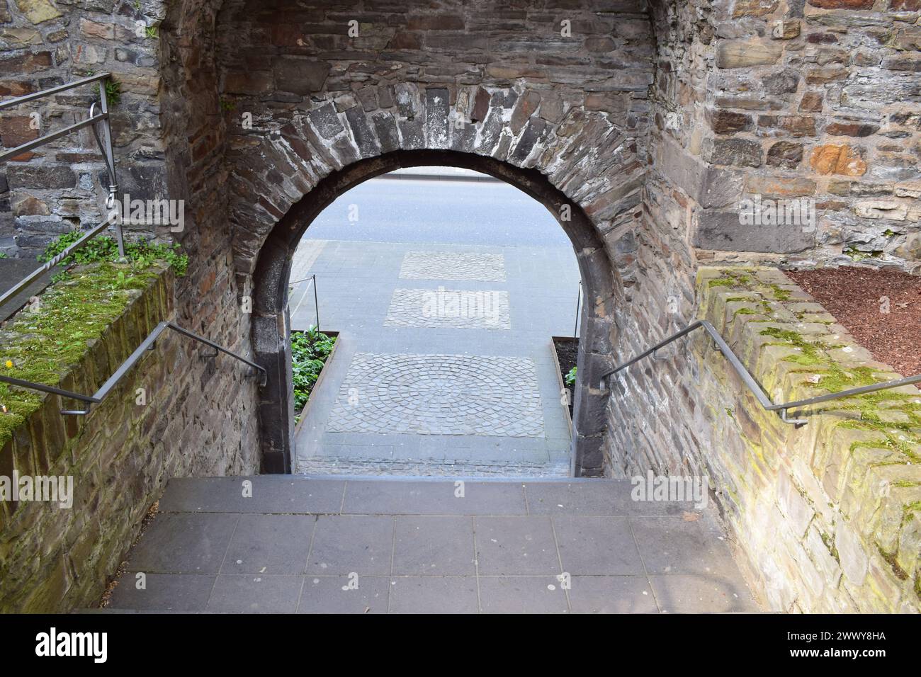 way through a city walls arch gate Stock Photo - Alamy