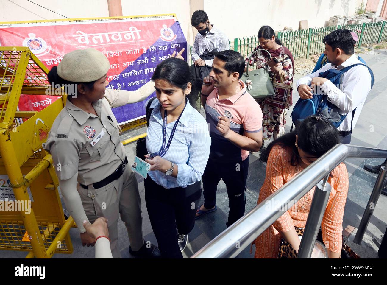 NEW DELHI, INDIA - MARCH 26: Security personnel check identification ...