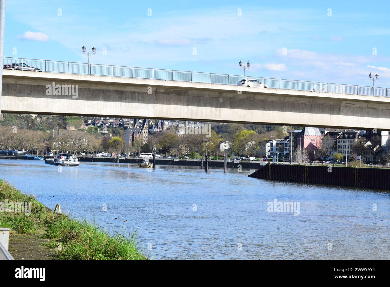 cargo ship under a Mosel bridge in Koblenz Stock Photo - Alamy