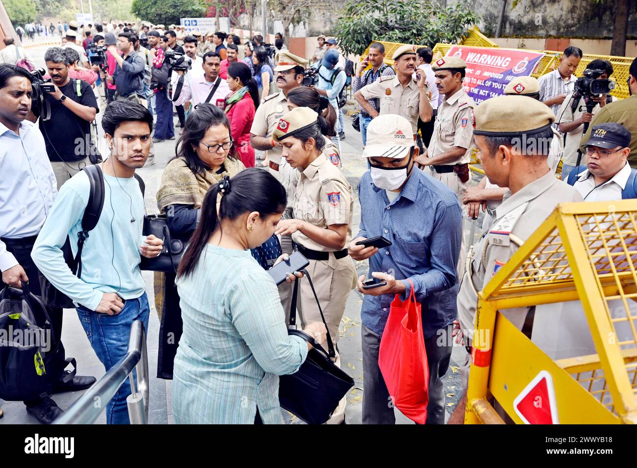NEW DELHI, INDIA - MARCH 26: Security personnel check identification ...