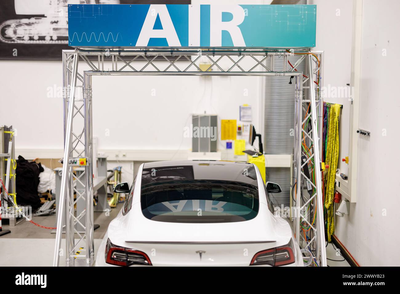 26 March 2024, Bavaria, Fürth: An electric vehicle stands under the ...