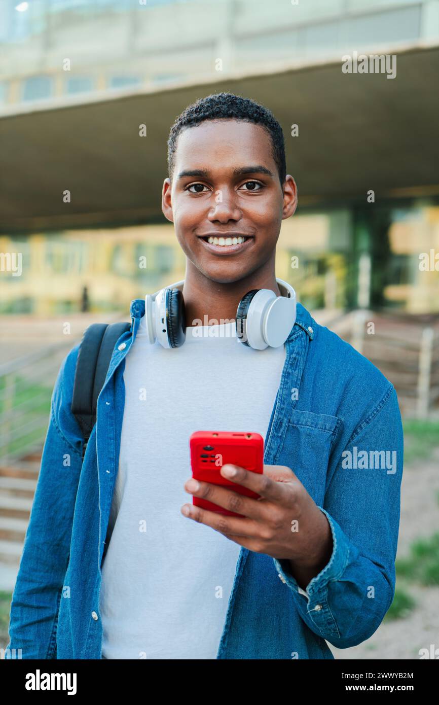Vertical portrait of one african american guy looking at camera and ...