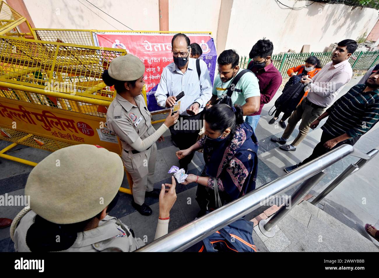 NEW DELHI, INDIA - MARCH 26: Security personnel check identification ...