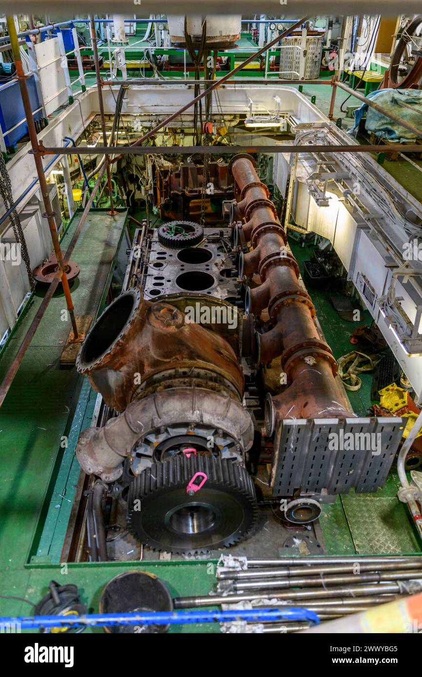 Main engine repairing. Inside engine room on big ship. Marine engine on ...