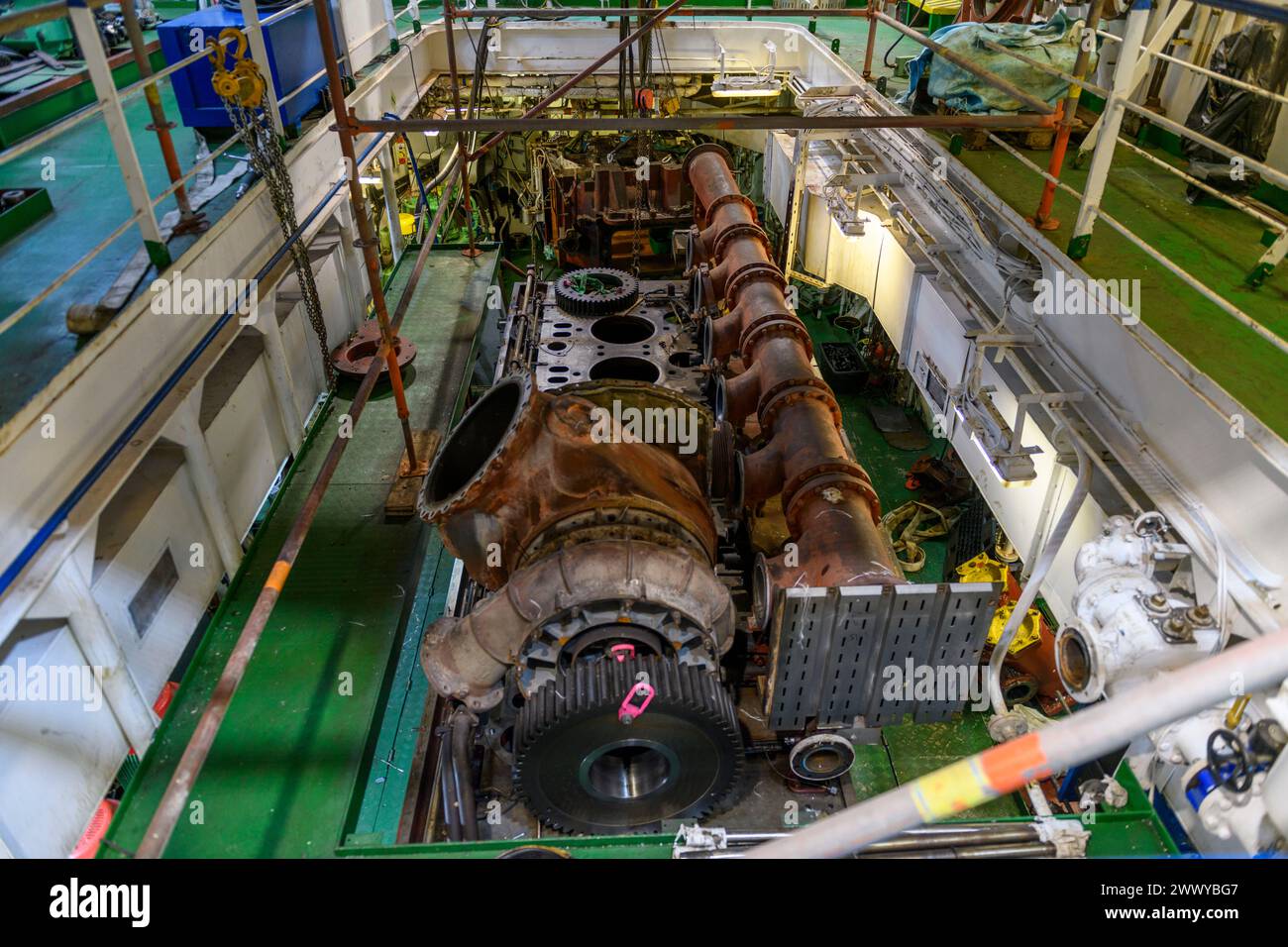 Main engine repairing. Inside engine room on big ship. Marine engine on ...