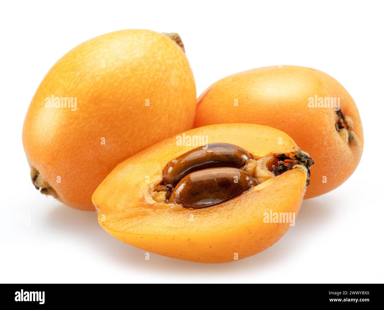 Ripe perfect loquats fruits with green leaves isolated on white ...