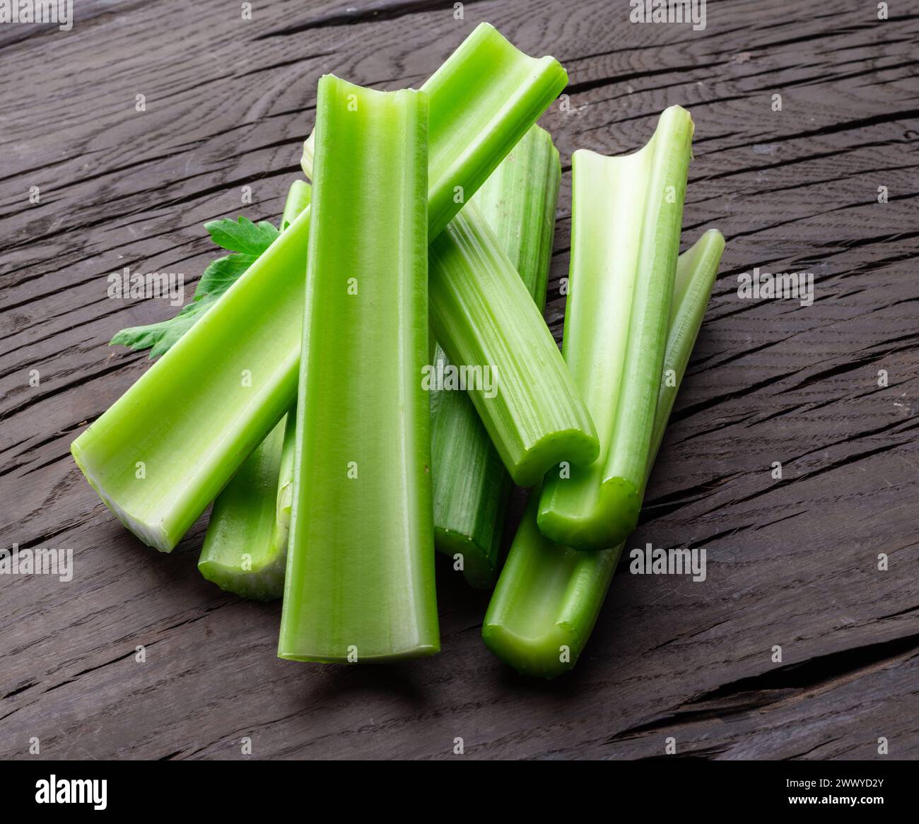 Pile of celery ribs isolated on white background Stock Photo - Alamy