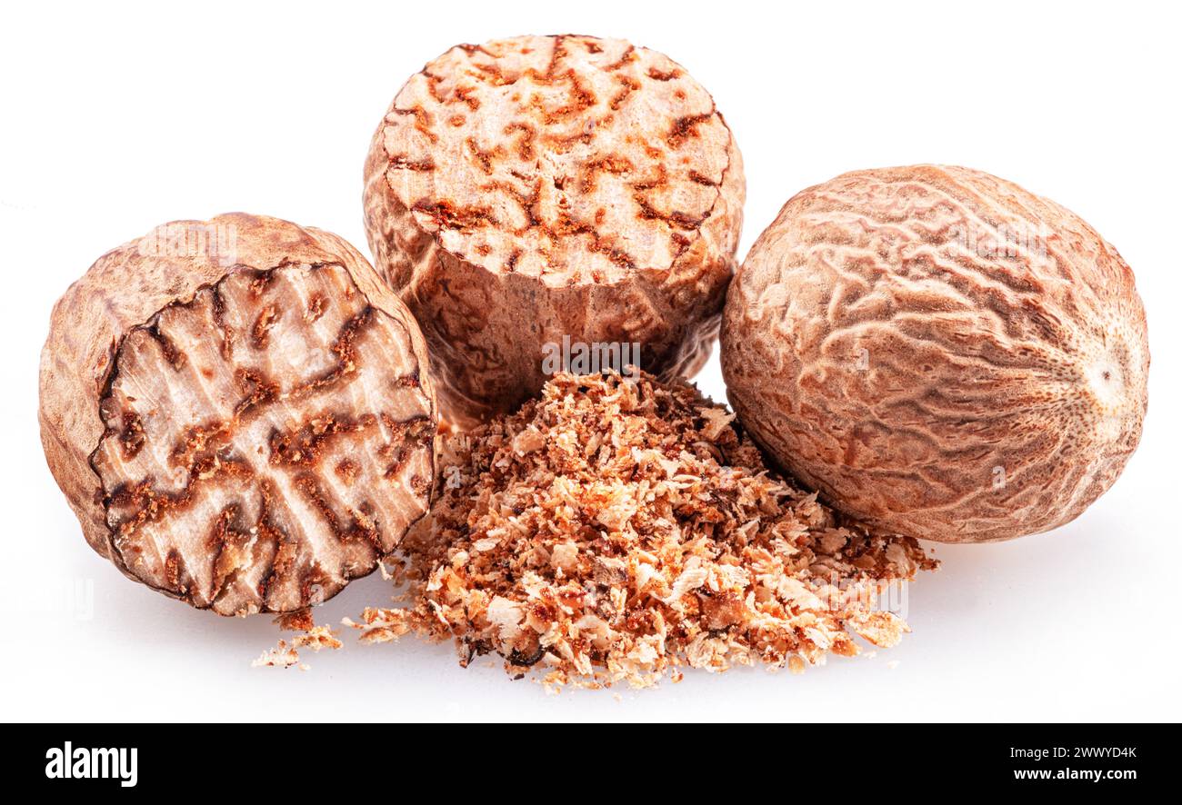 Nutmeg and ground nutmeg heap isolated on white background Stock Photo ...
