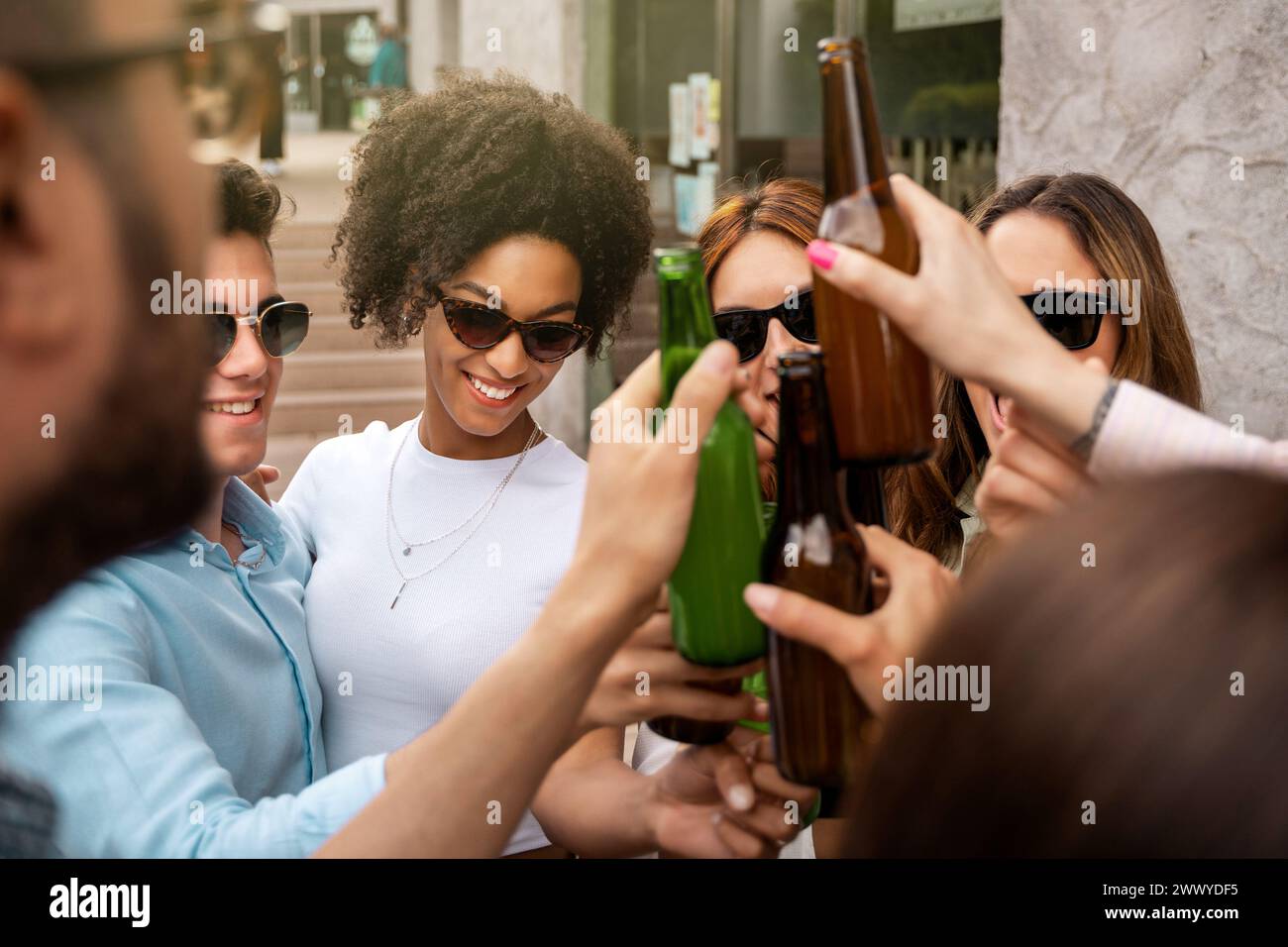 Cheerful group toasts outdoors hi-res stock photography and images - Alamy