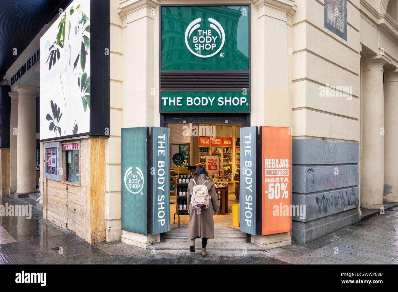 A customer enters the British cosmetics, skin care and perfume company ...