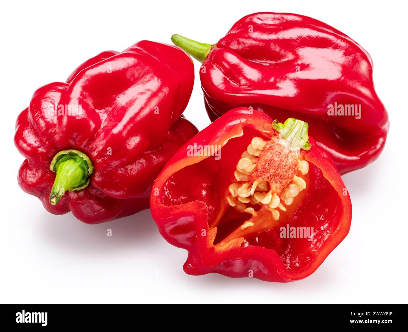 Red habanero peppers and habanero cross section on white background ...