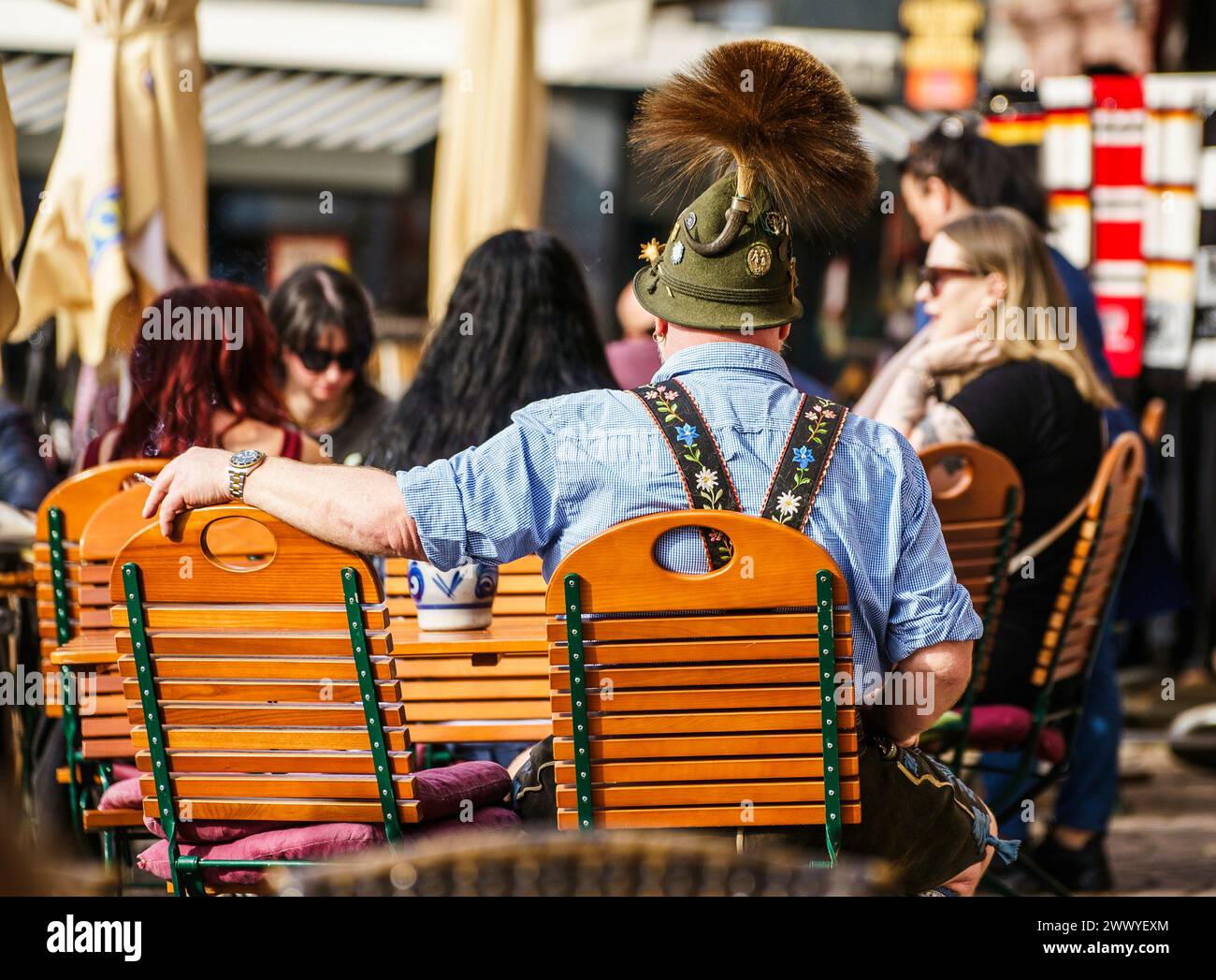 20 March 2024, Hesse, Frankfurt/Main: A man in traditional Bavarian ...