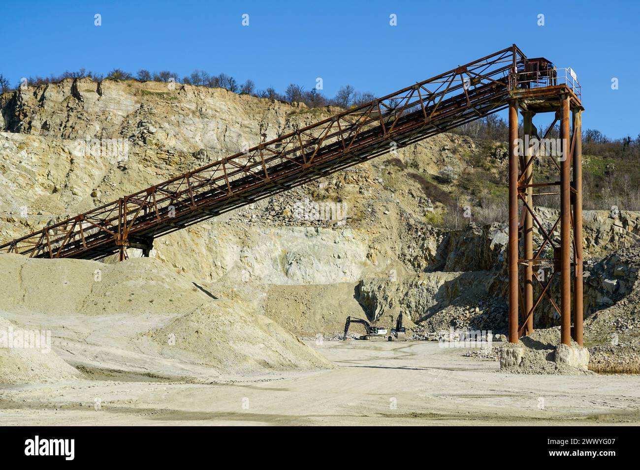 Huge rusty metal structures for transporting rocks in a dolomite mining ...
