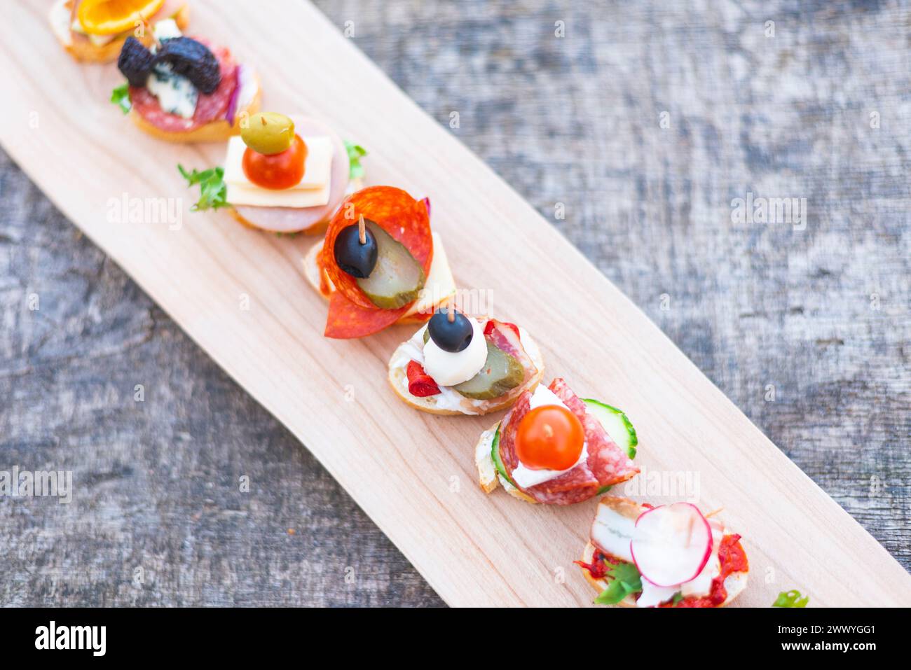 Finger food , various canapes with vegetables, ham, bacon , cheese and ...