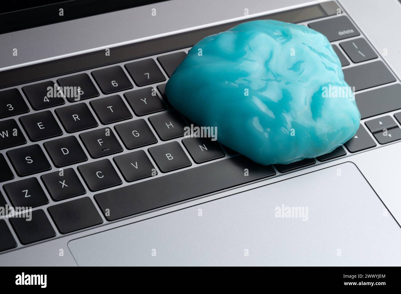Big blue sludge compound on black keyboard close up view Stock Photo ...