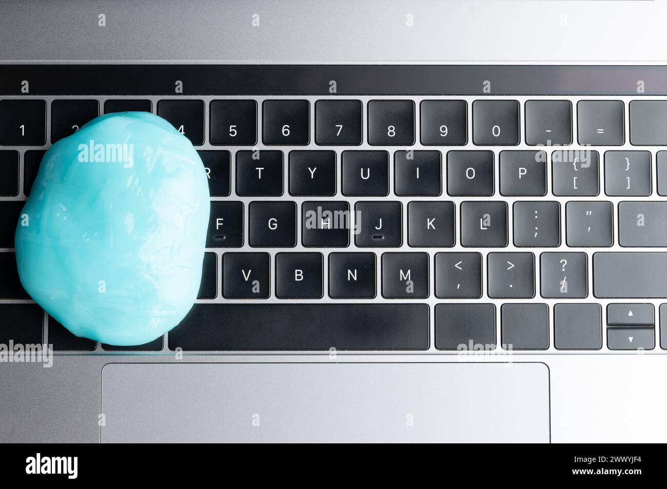 Clean keyboard with blue compound gel above top view Stock Photo - Alamy