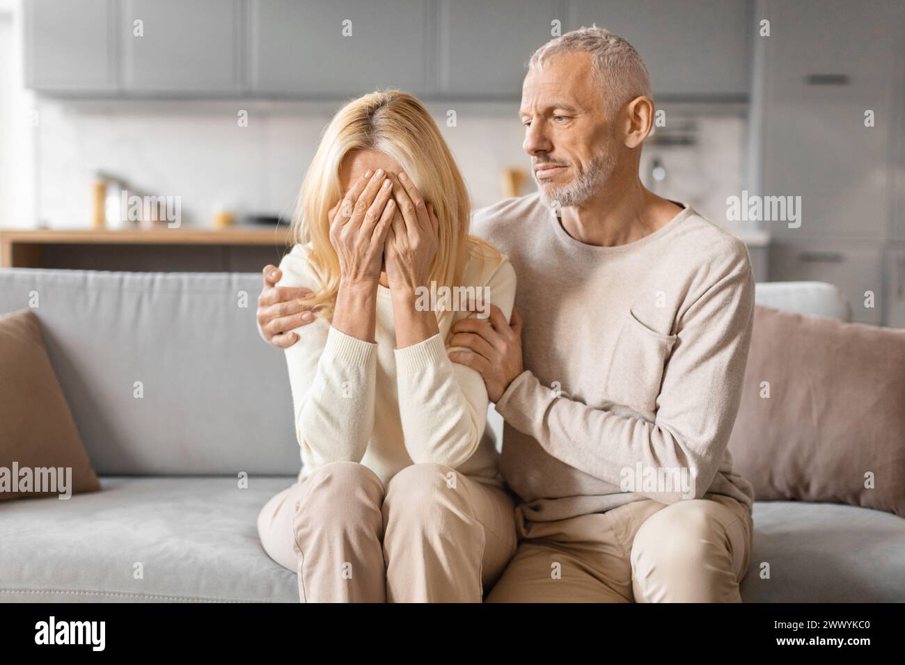 Couple comforting each other in times of distress Stock Photo - Alamy