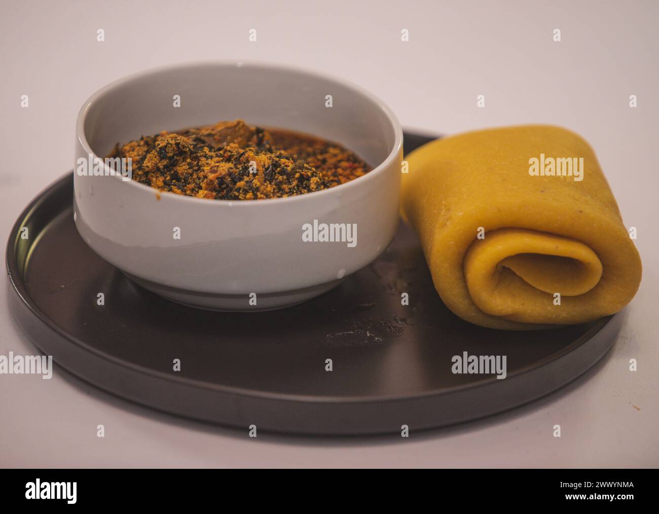 Eba and Egusi Soup Stock Photo - Alamy