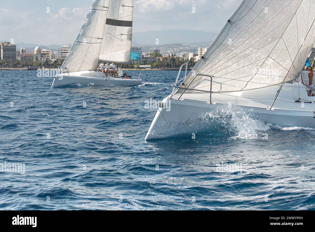Sailing yachts competing in a regatta on the tranquil mediterranean sea ...