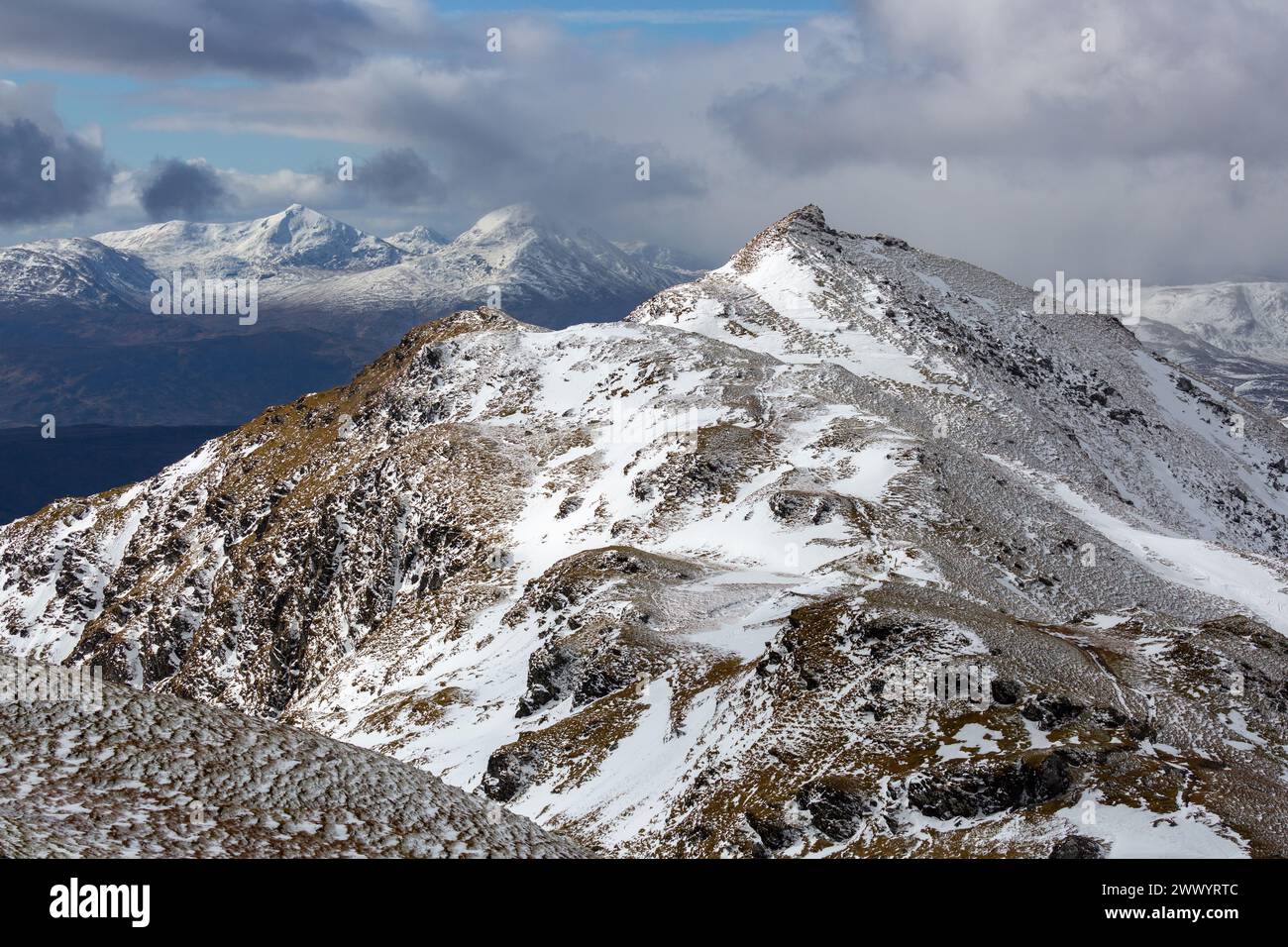Looking towards the rocky summit of Meall Garbh along the Tarmachan ...