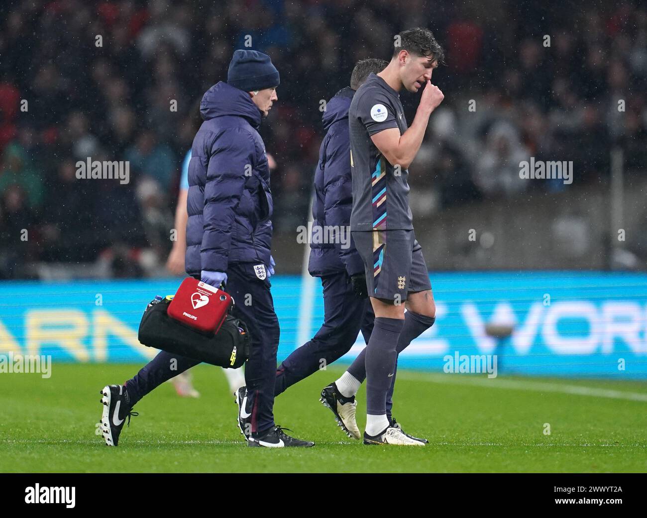 England's John Stones leaves the pitch with an injury during the ...