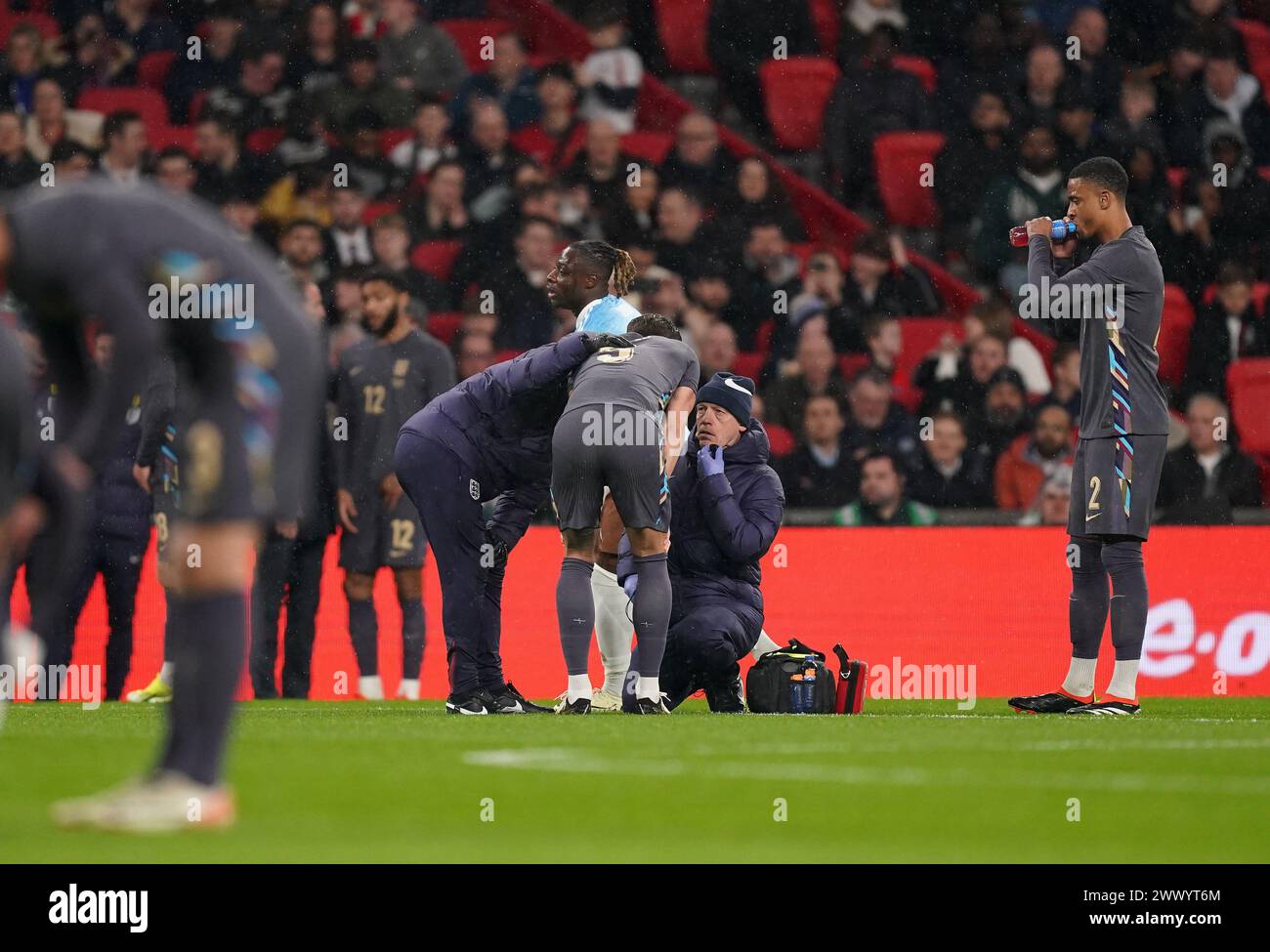 England's John Stones receives treatment for an injury during the ...