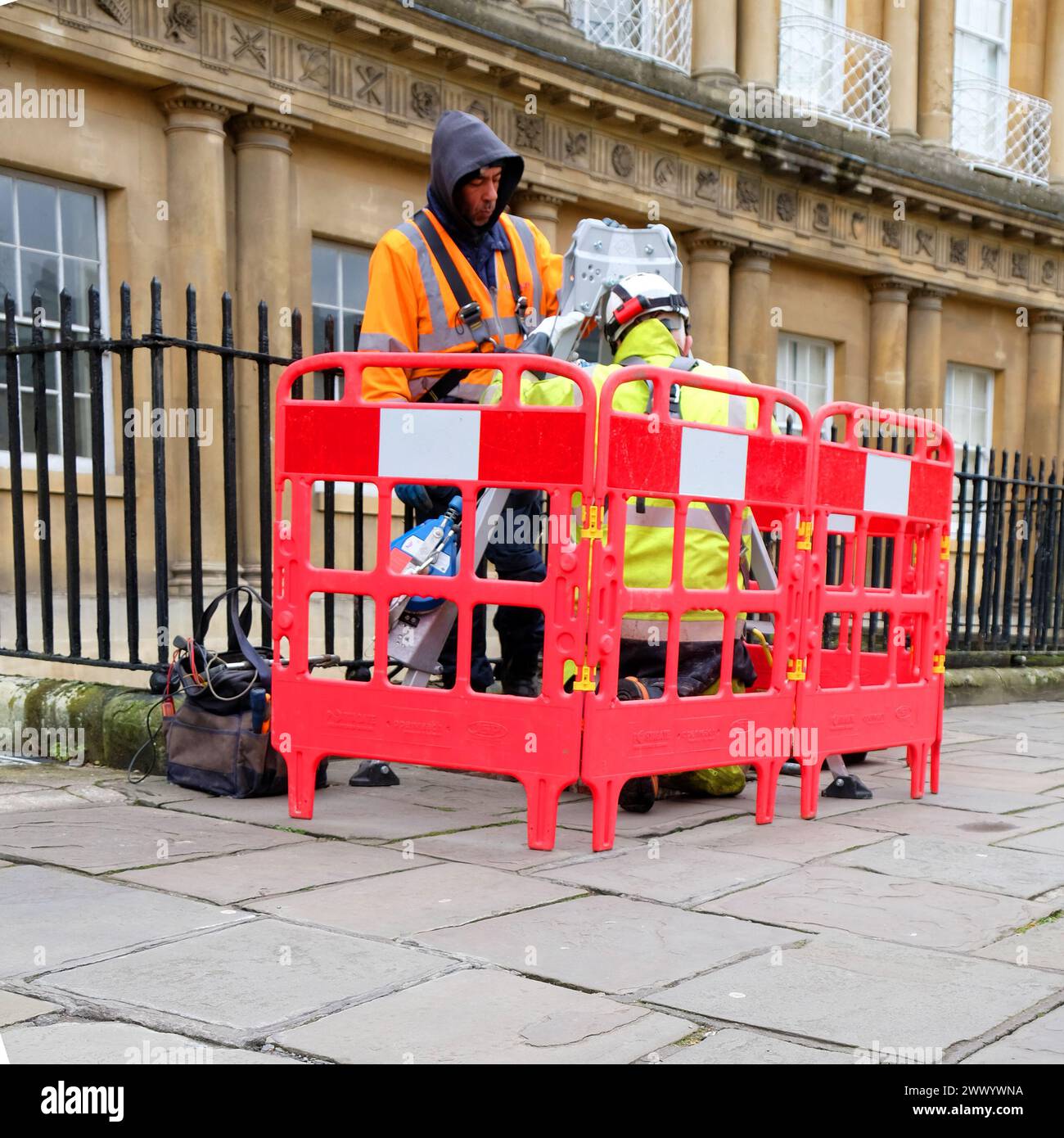 March 2024 - Engineers working behind safety barriers on the streets of ...