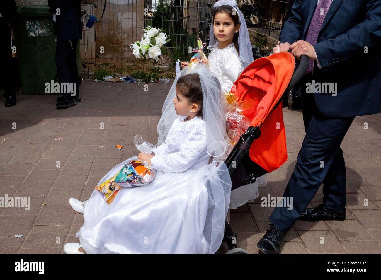 Two young girls dressed as Queen Esther are seen during the Purim ...