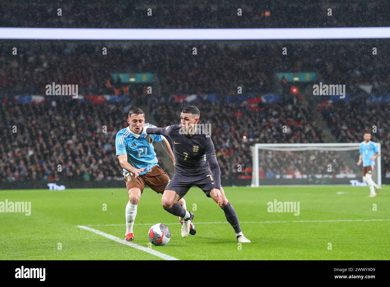 Phil Foden of England holds off Timothy Castagne of Belgium during the ...
