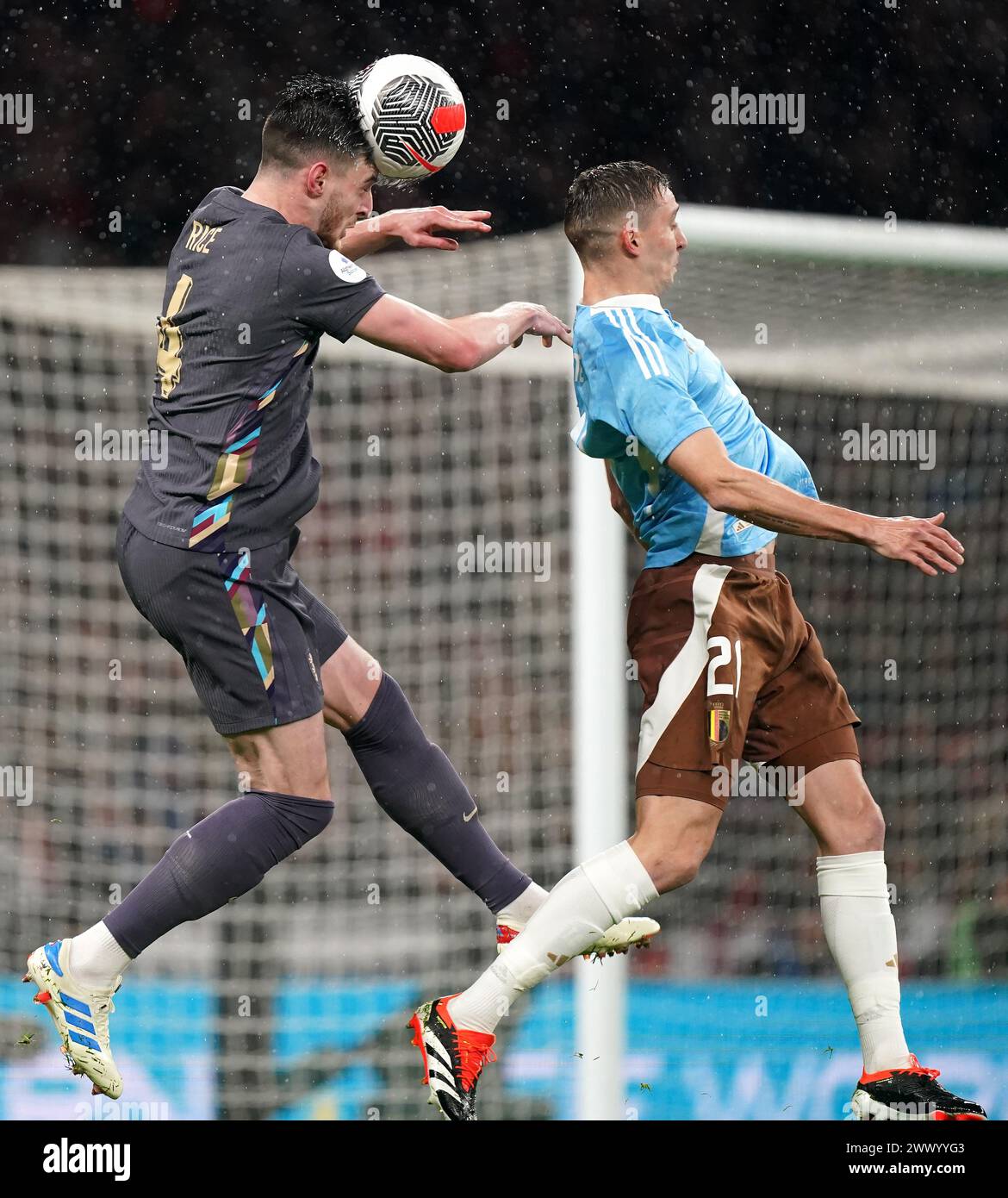 England's Declan Rice (left) and Belgium's Timothy Castagne battle for ...