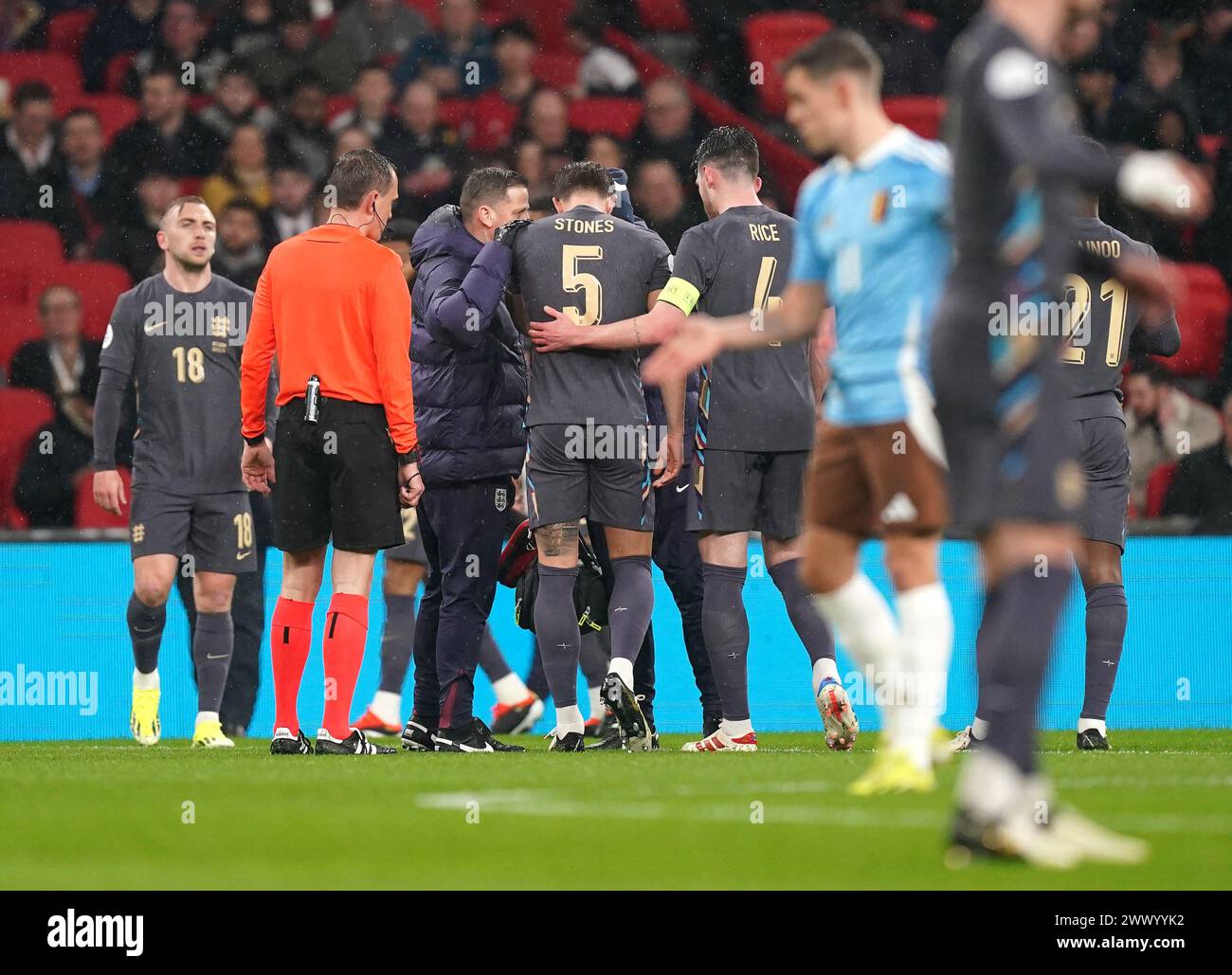 England's John Stones leaves the pitch after picking up an injury ...